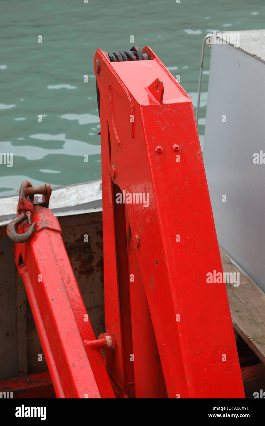 Detail of a red jib crane on a boat Stock Photo - Alamy