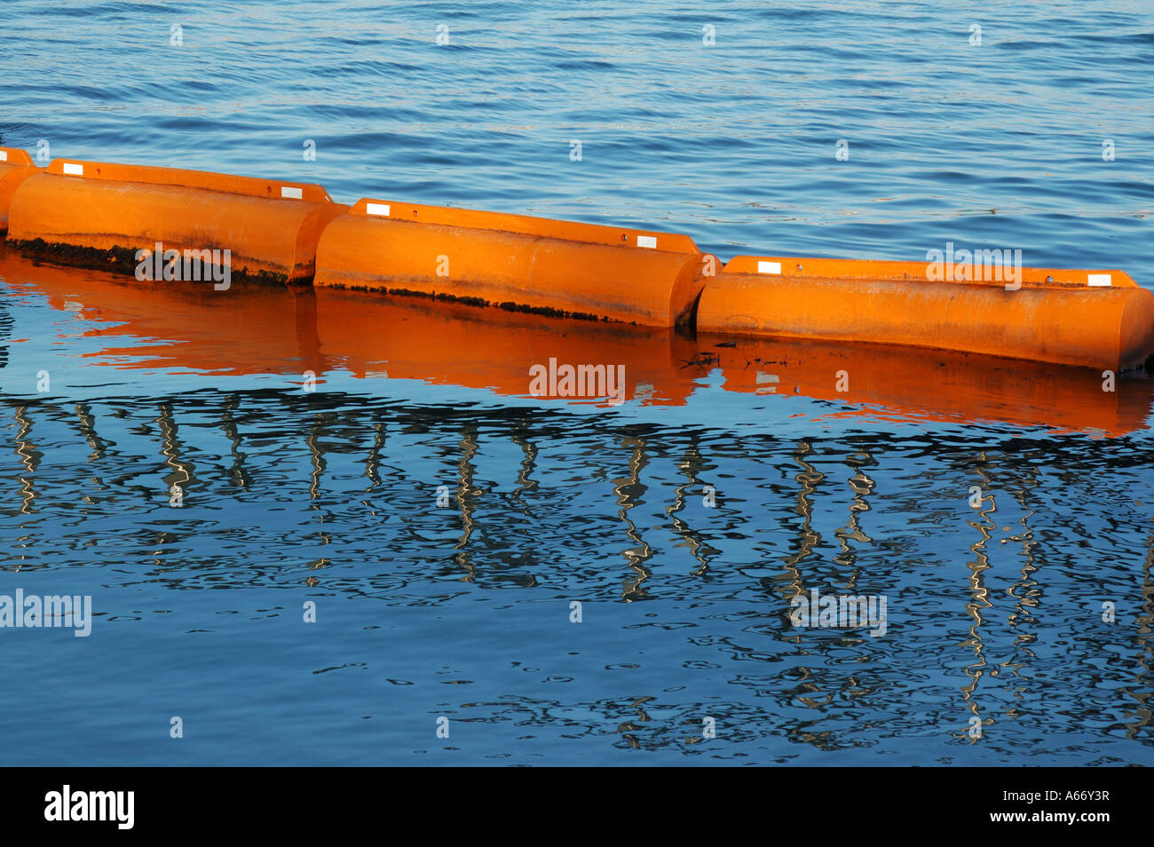 Detail of a floating barrier on the water Stock Photo - Alamy