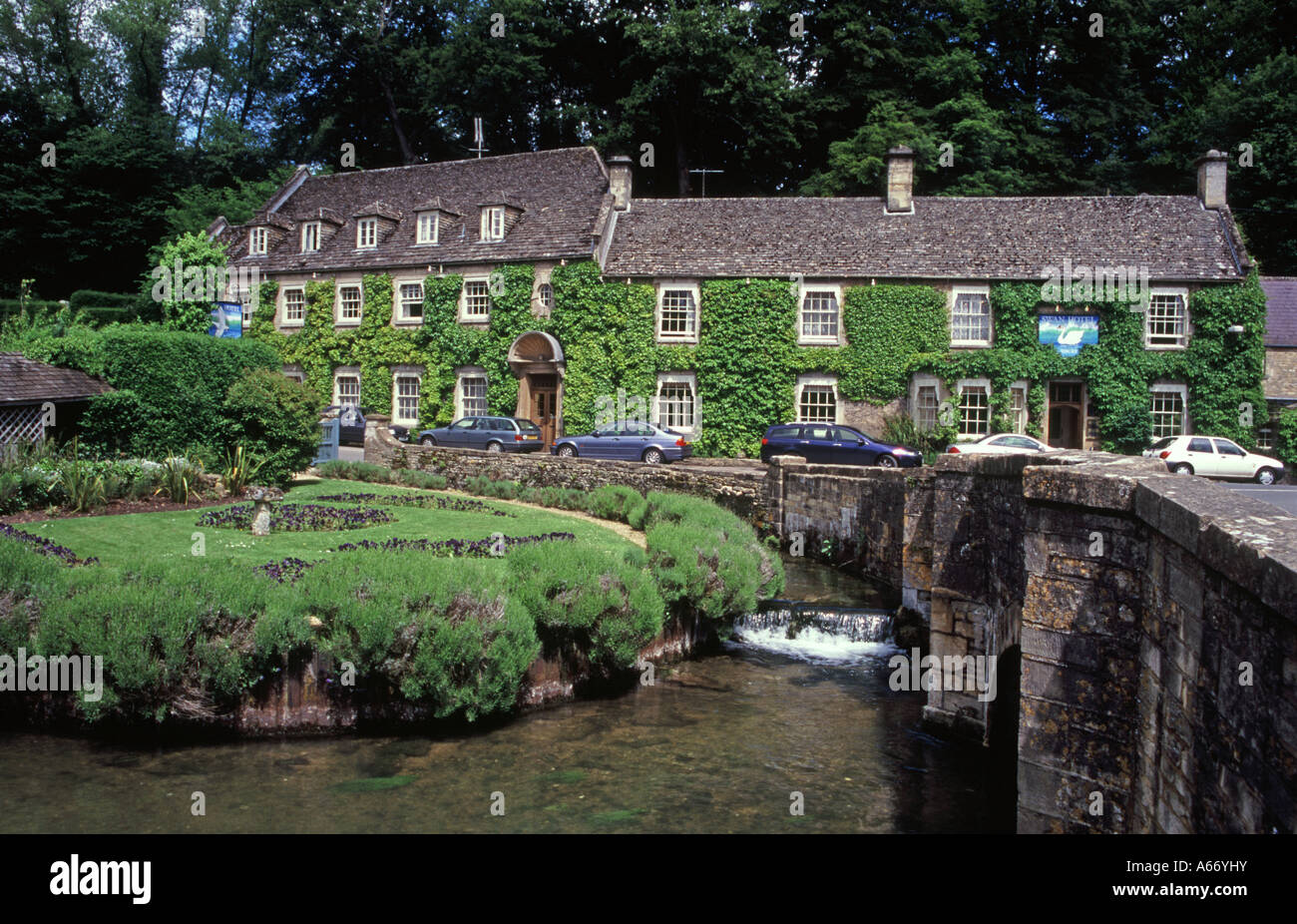 Swan Hotel and river Coln Bibury Gloucestershire Stock Photo - Alamy