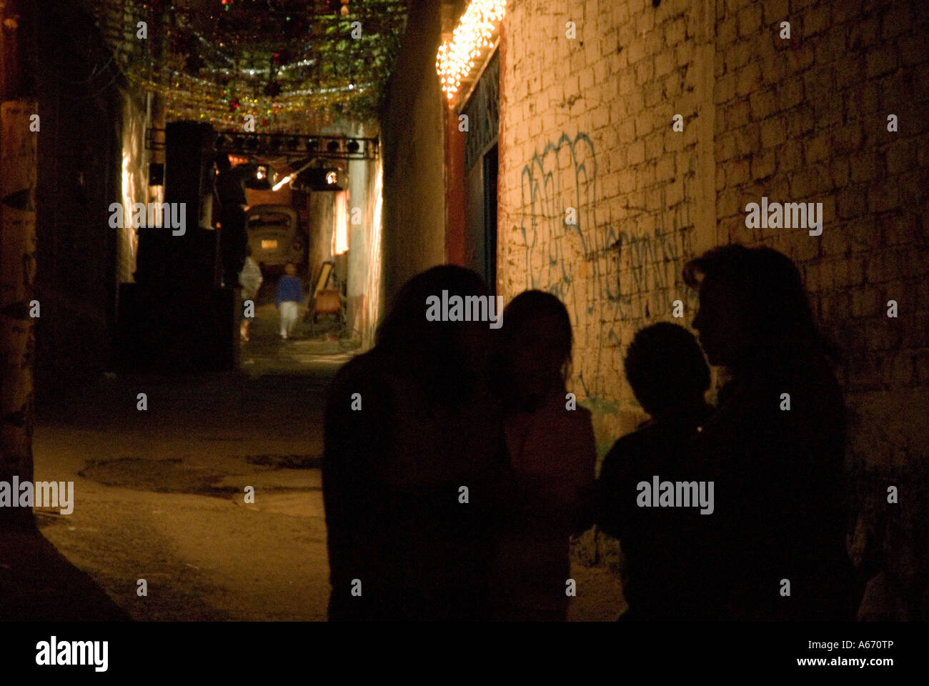 Women talk at night in the street - mexico city Stock Photo - Alamy
