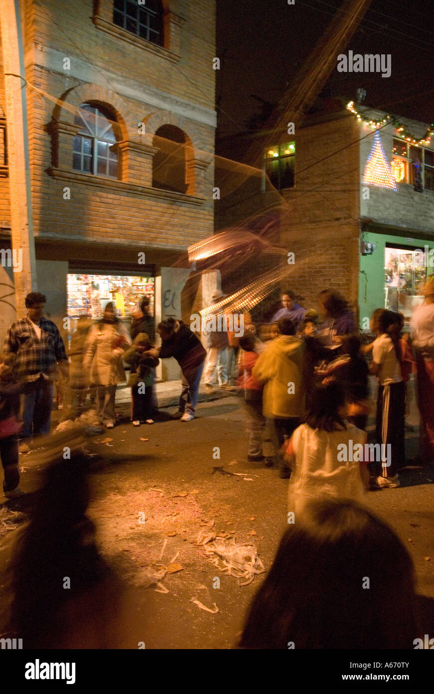 breaking the pinata - posada, the christmas game at night - mexico city ...