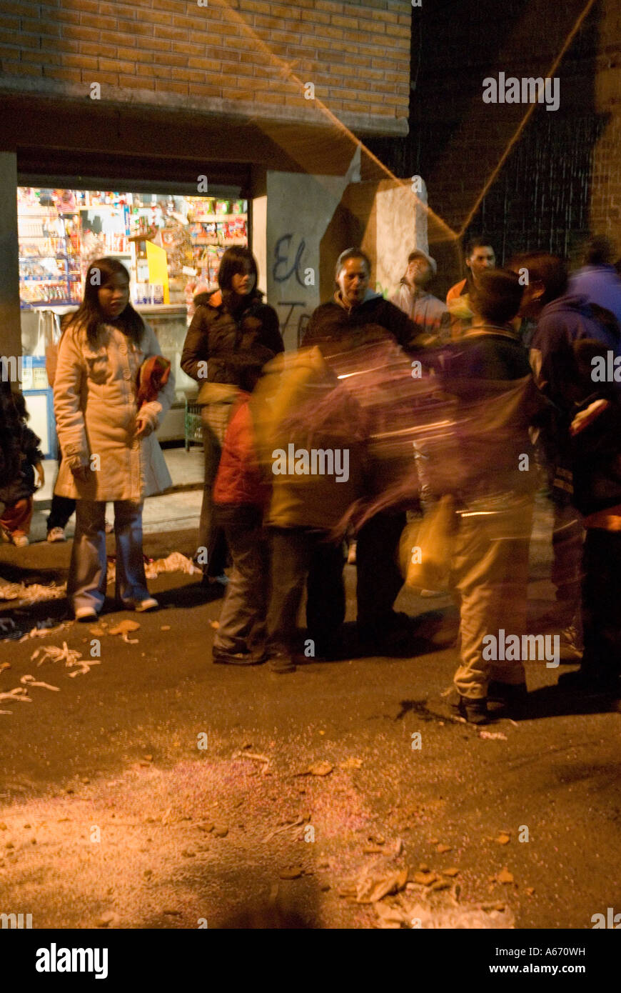 breaking the pinata - posada, the christmas game at night - mexico city ...