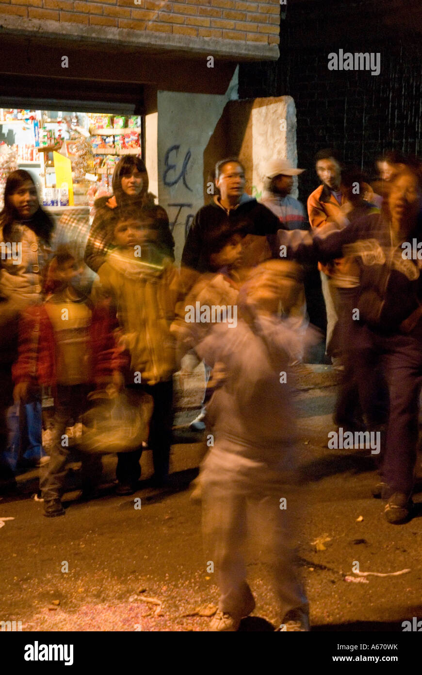 breaking the pinata - posada, the christmas game at night - mexico city ...