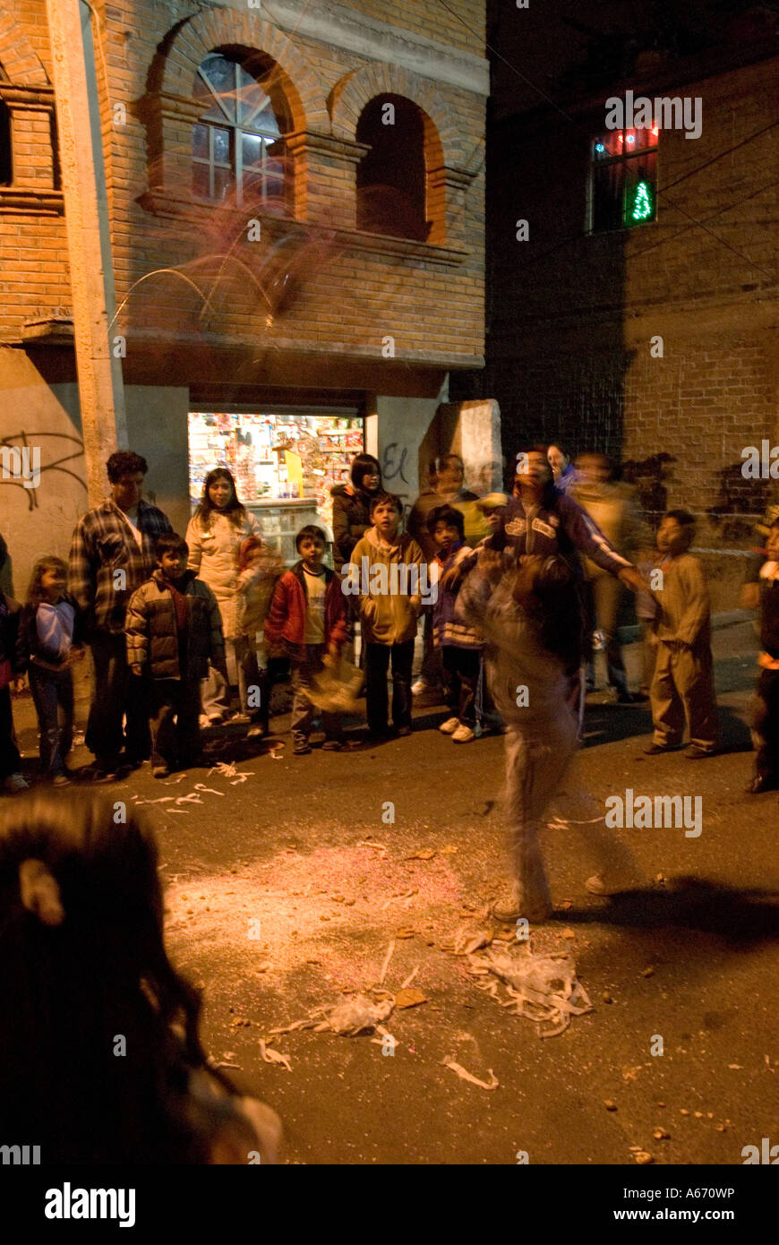 breaking the pinata - posada, the christmas game at night - mexico city ...