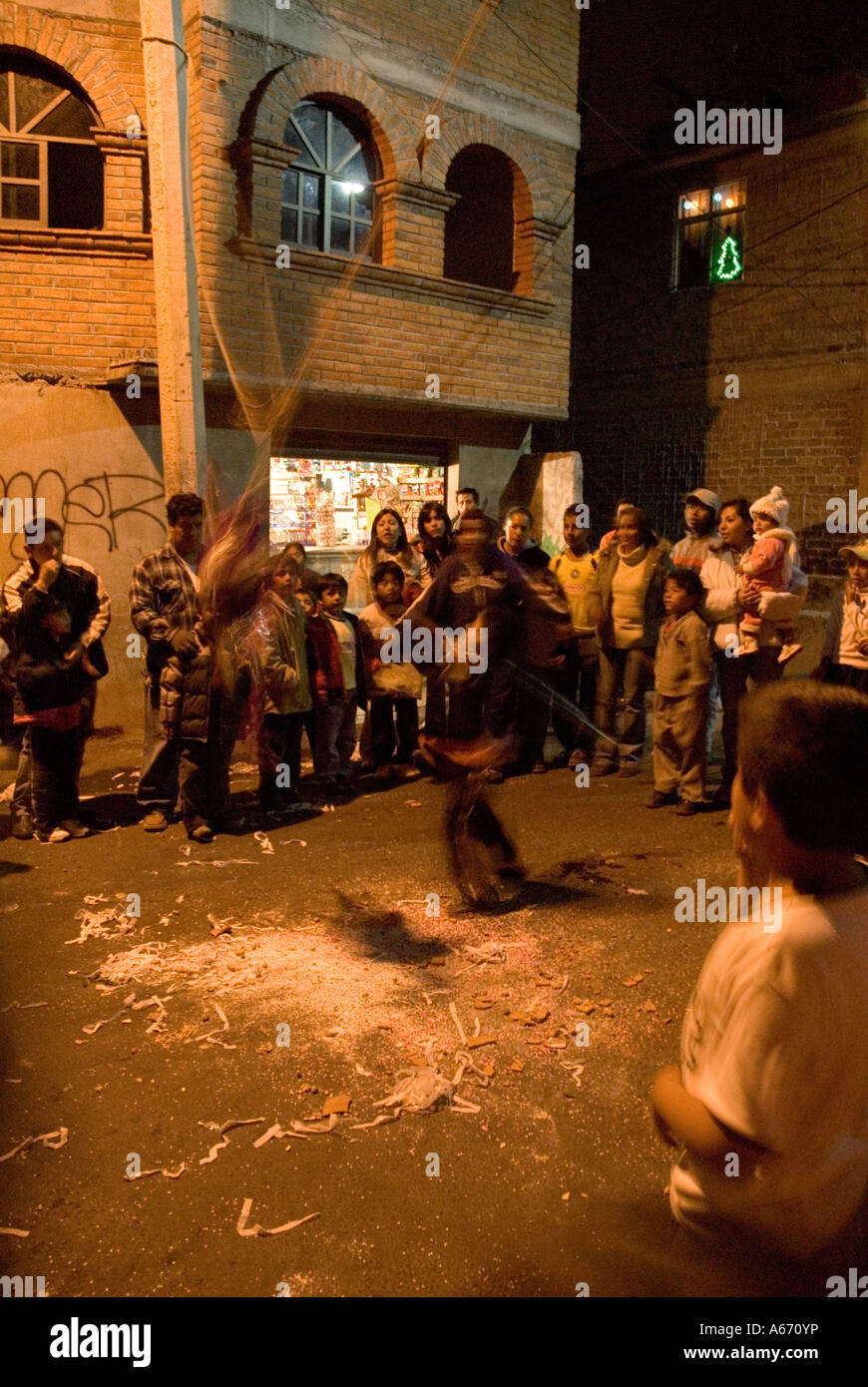 breaking the pinata - christmas game at night - mexico city Stock Photo ...