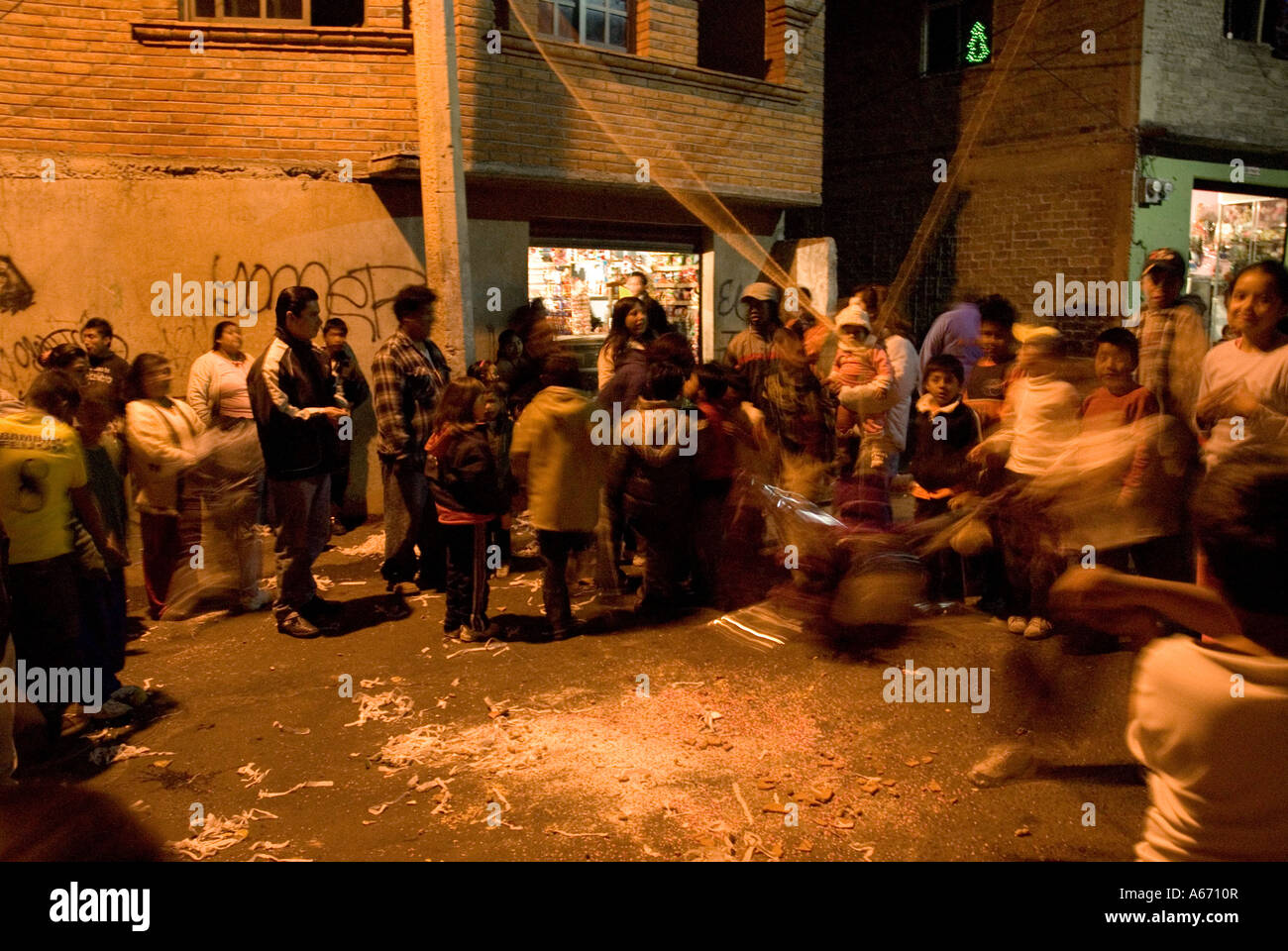 breaking the pinata - christmas game at night - mexico city Stock Photo ...
