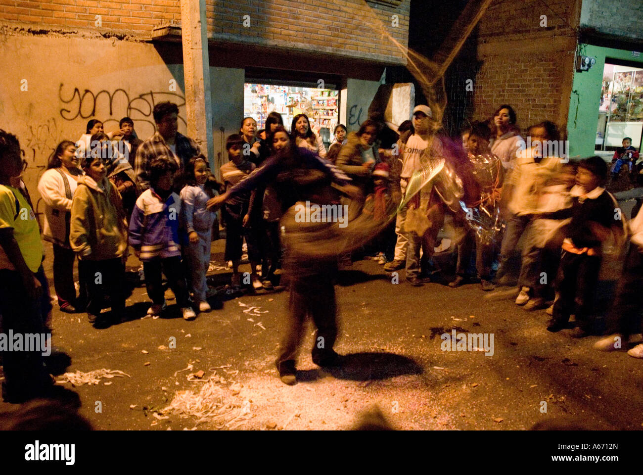 breaking the pinata - posada, the christmas game at night - mexico city ...