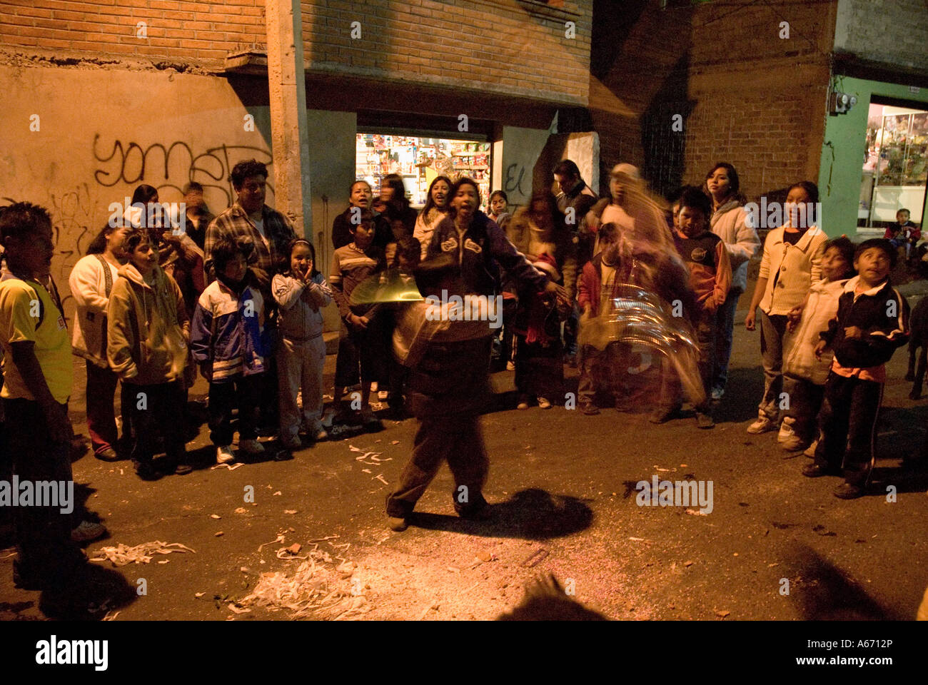 breaking the pinata - posada, the christmas game at night - mexico city ...