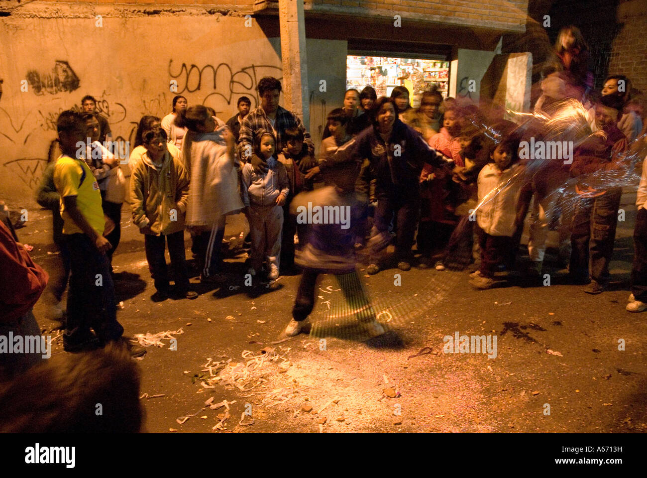 breaking the pinata - posada, the christmas game at night - mexico city ...