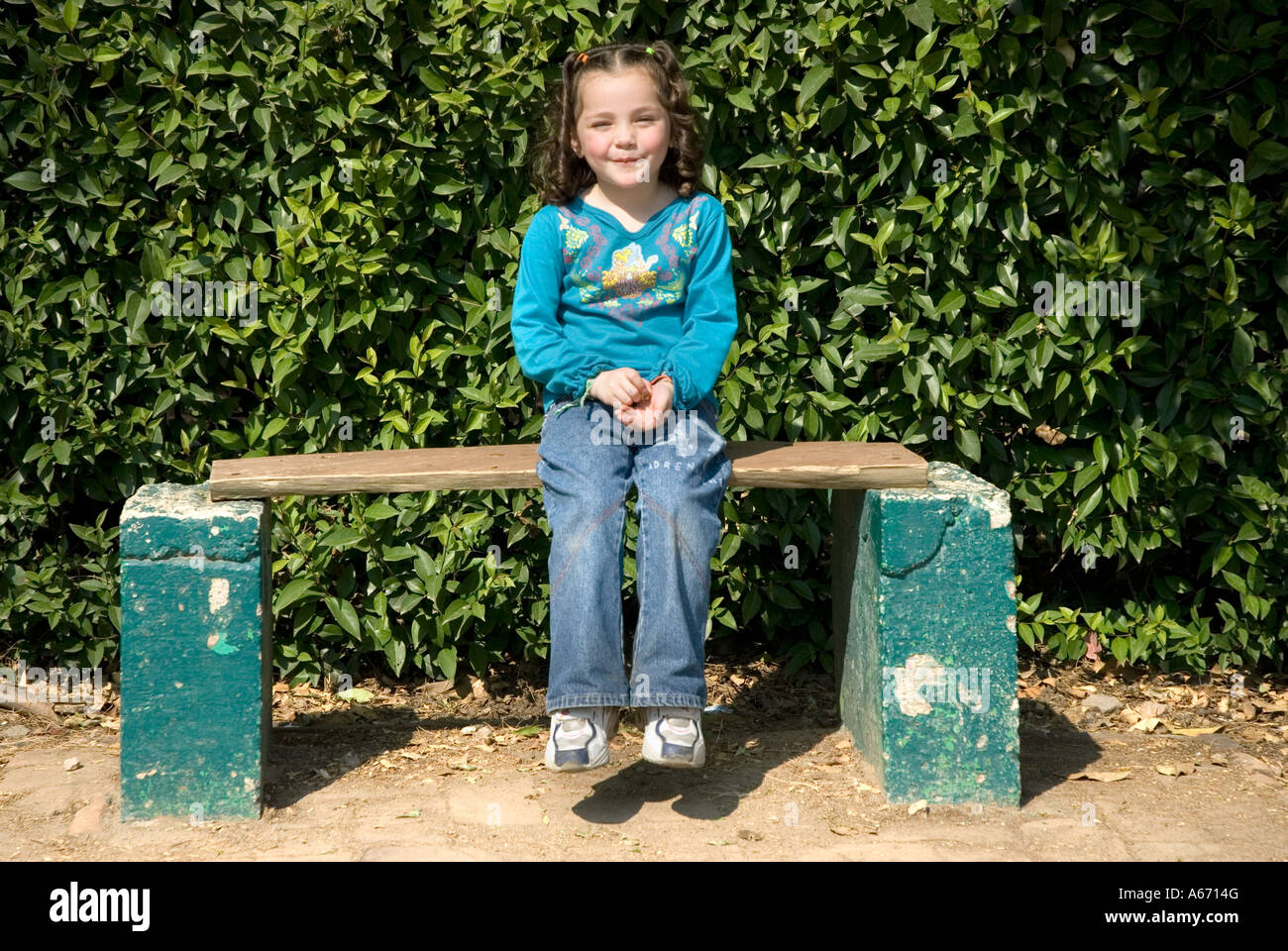 child seated in a bench - coyoacan viveros park - mexico Stock Photo ...