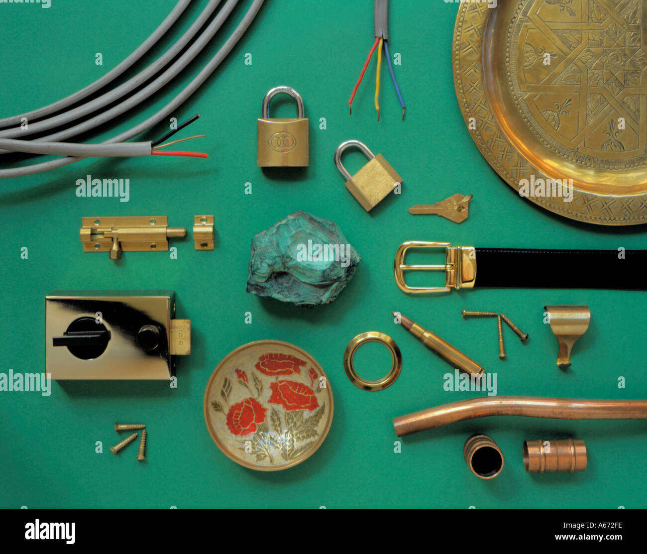 Sample of malachite and display of various objects made from copper and ...