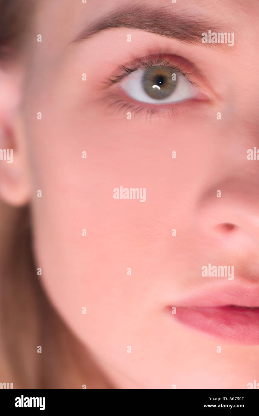 Half-face close-up of young woman Stock Photo - Alamy