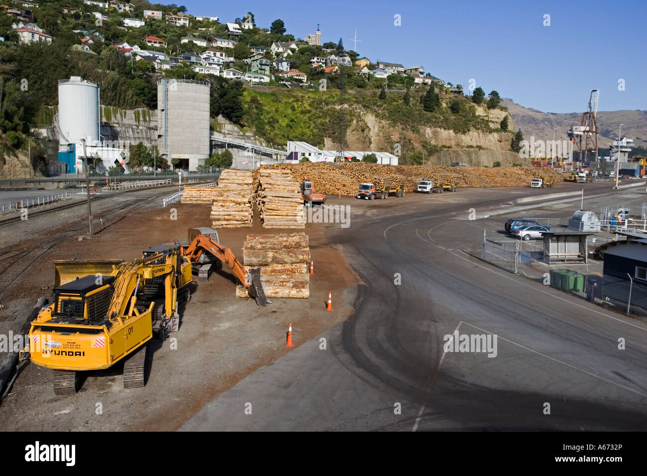 Timber logs stacked on quayside at Lyttleton Port near Christchurch New ...