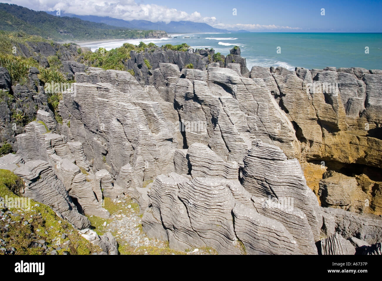 Layered limestone rocks in cliffs at Pancake Rocks Punakaiki South ...
