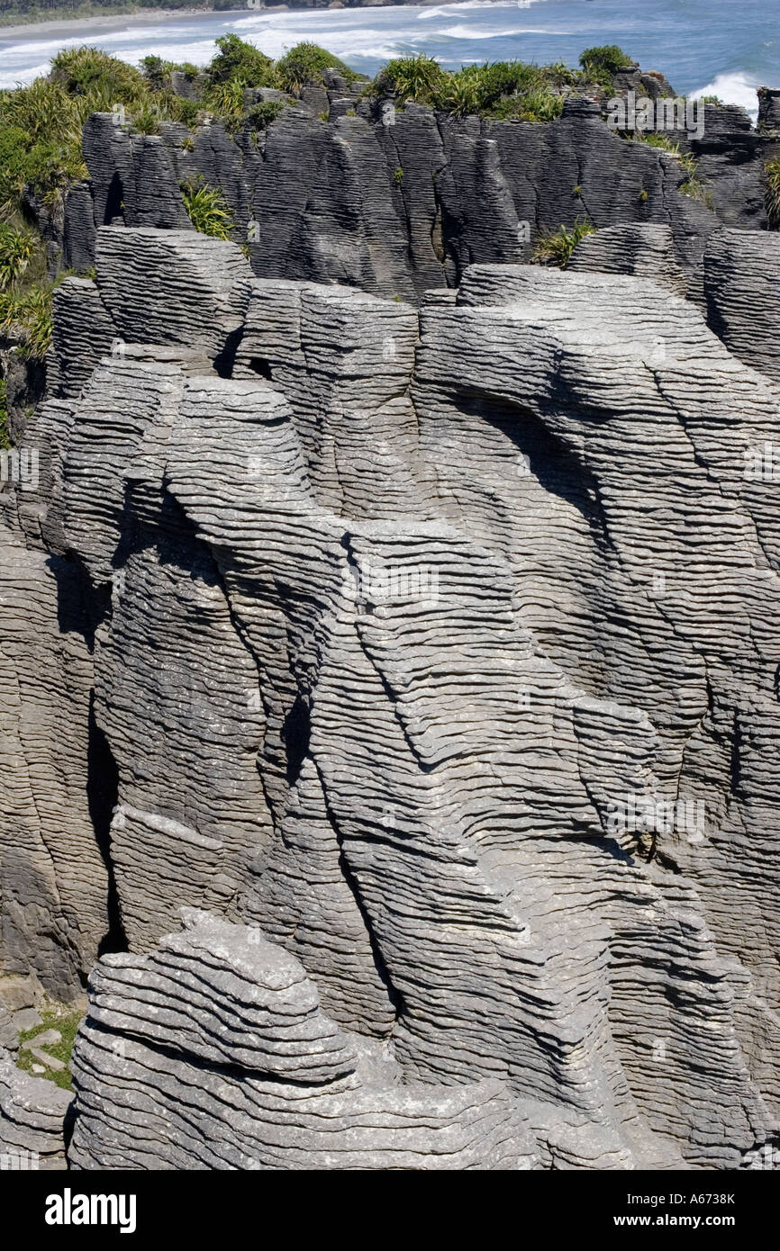 Layered limestone rocks in cliffs at Pancake Rocks Punakaiki South ...