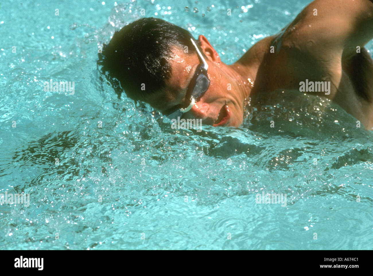 athletic young man swimming in contest Stock Photo - Alamy