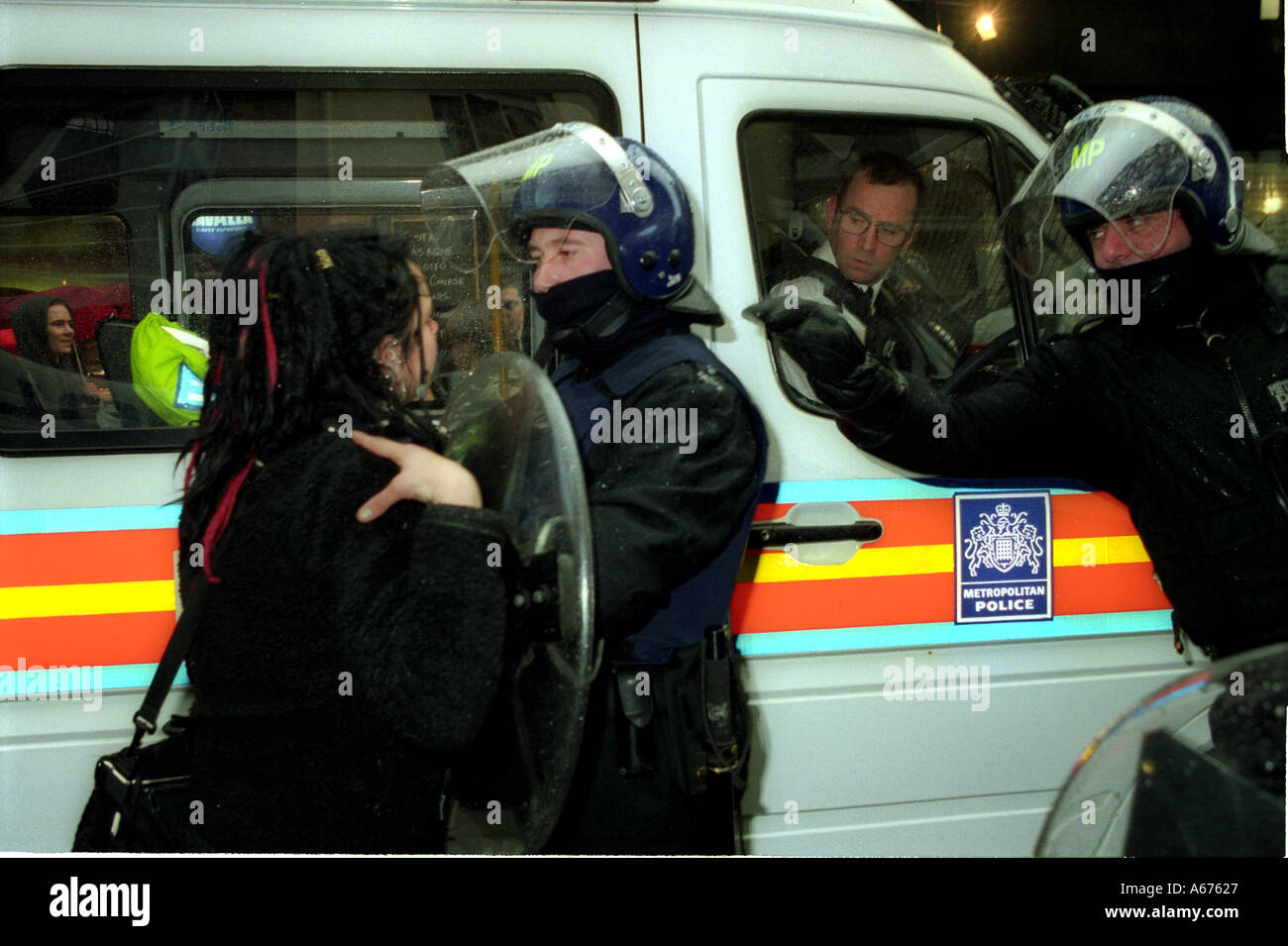 Police confrontation during evening of Mayday demonstration 2002 Stock ...