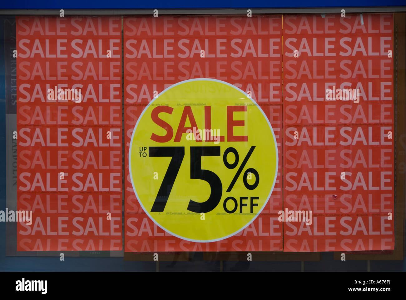 High street shop window with January sales banner posters advertising ...
