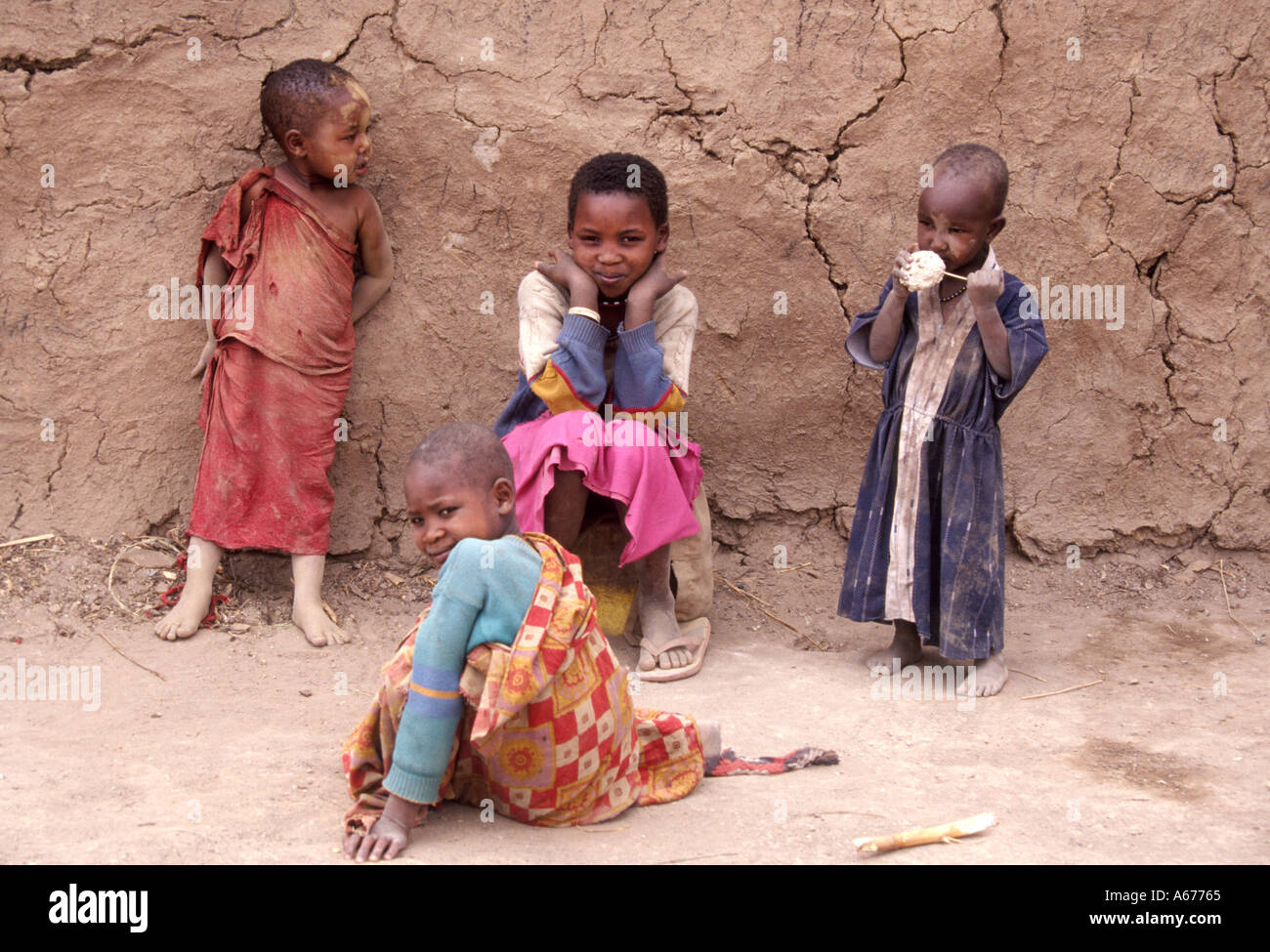 Maasai children playing outside their home Stock Photo - Alamy