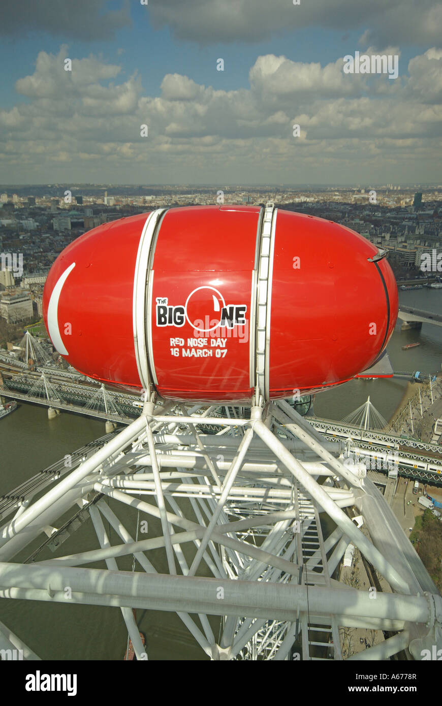 One pod on high spot London Eye Ferris wheel decorated red to help ...
