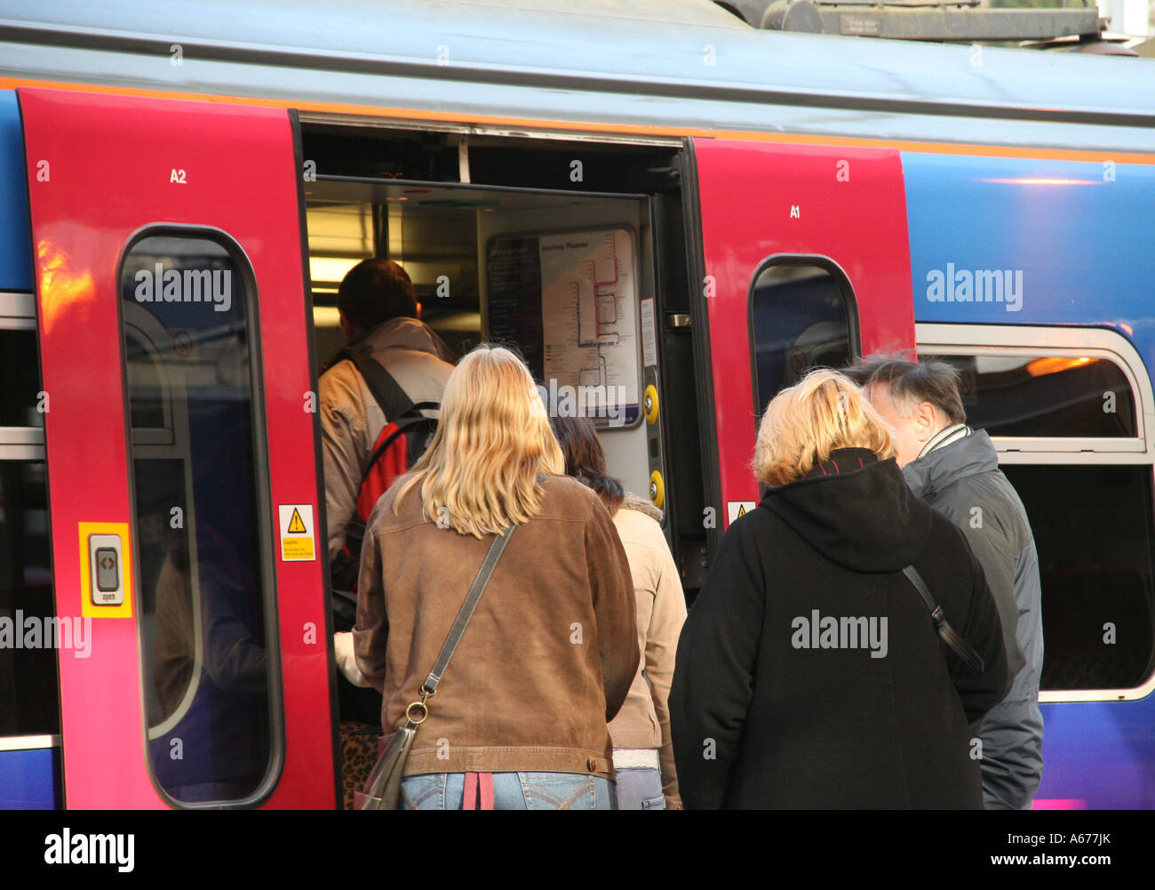 Commuters Board Train at Huntingdon Station Stock Photo - Alamy