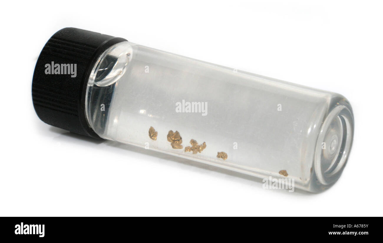 Vial of gold flakes Stock Photo - Alamy