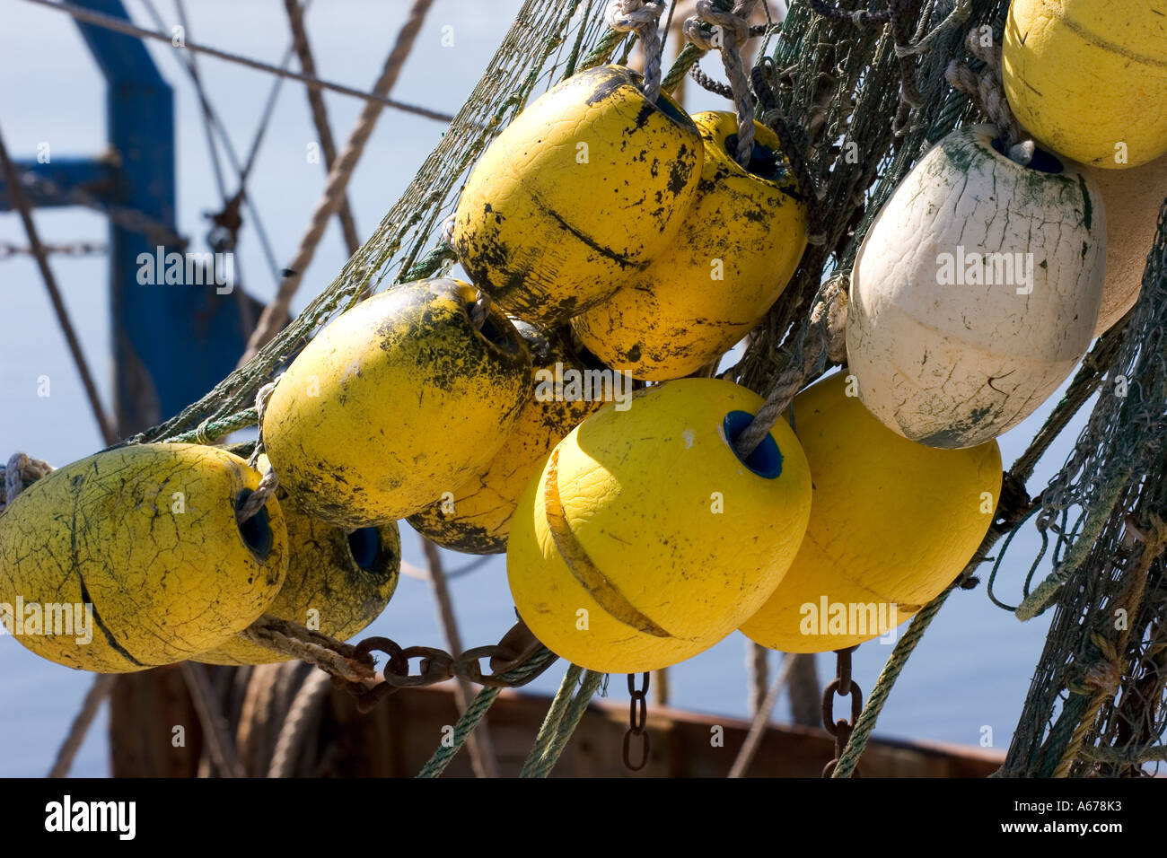 Close up of fishing net rollers Stock Photo - Alamy