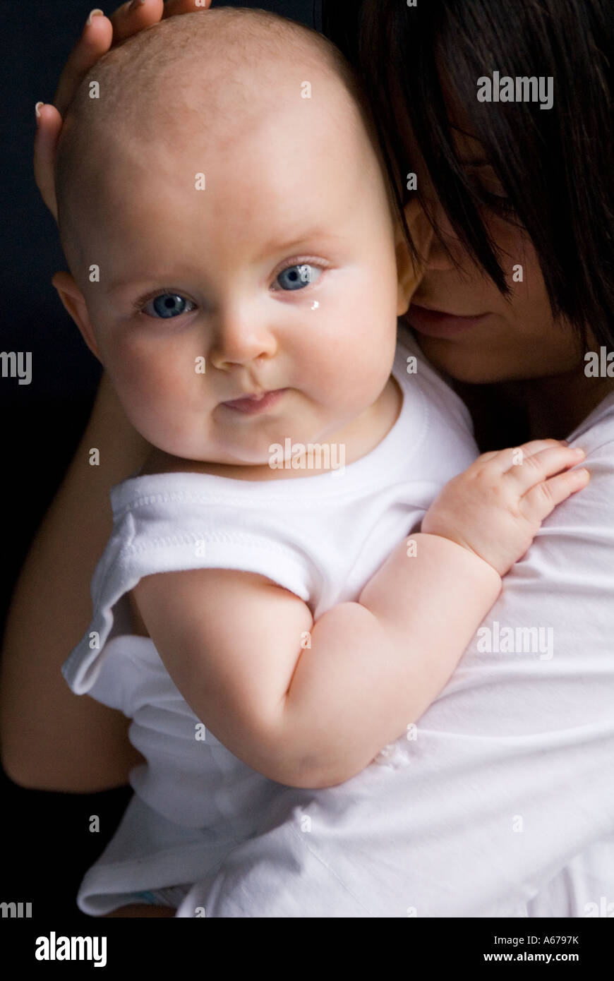 Mother comforts baby Stock Photo - Alamy