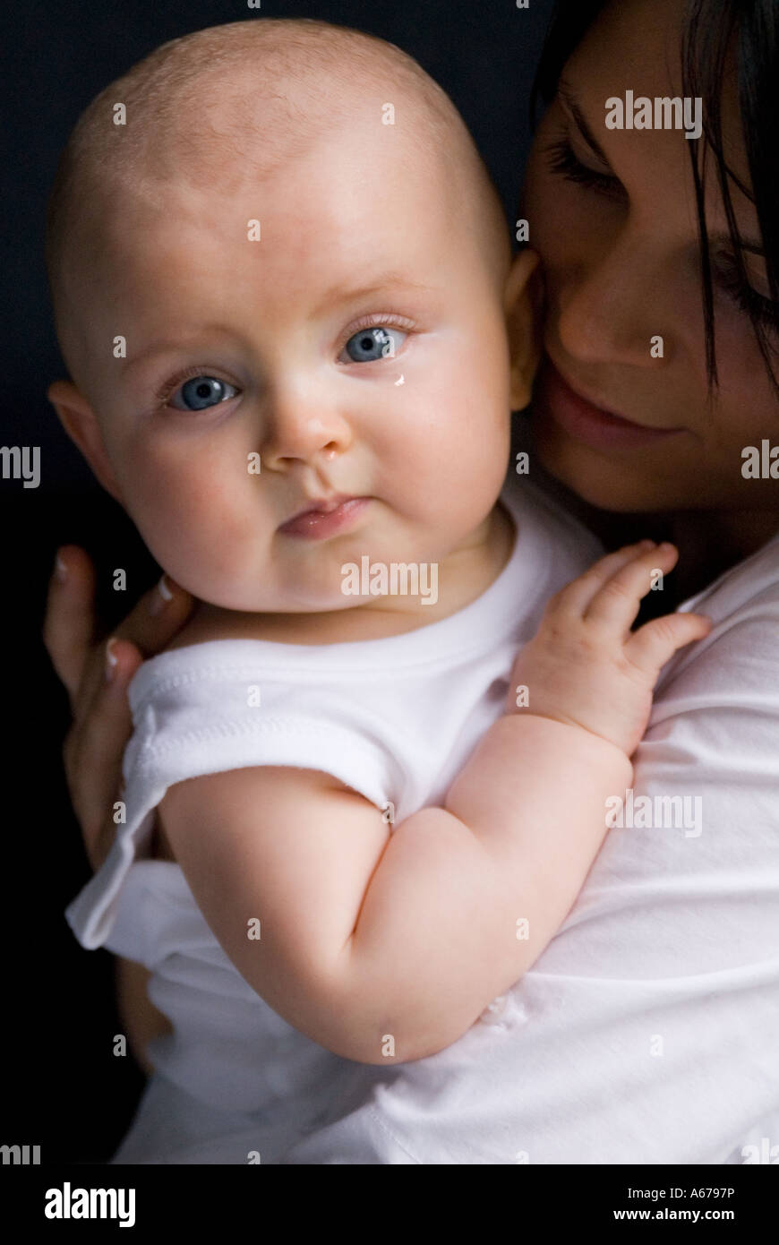 Mother comforts baby Stock Photo - Alamy