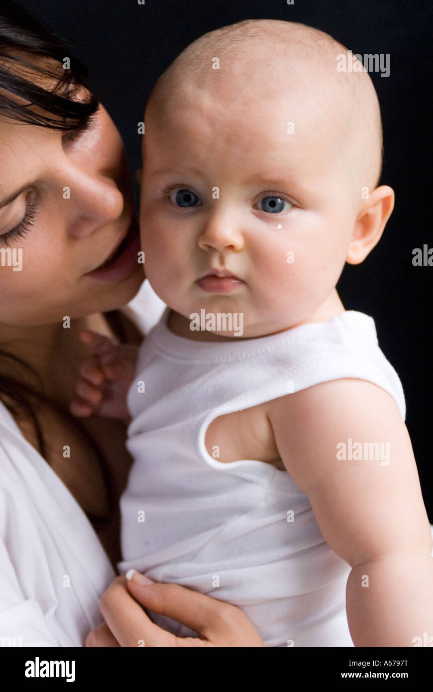 Mother comforts baby Stock Photo - Alamy