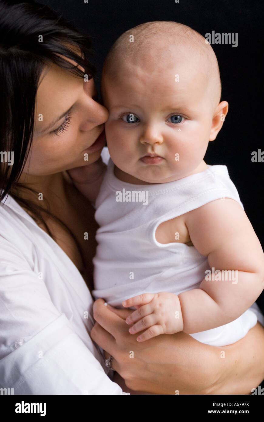 Mother comforts baby Stock Photo - Alamy