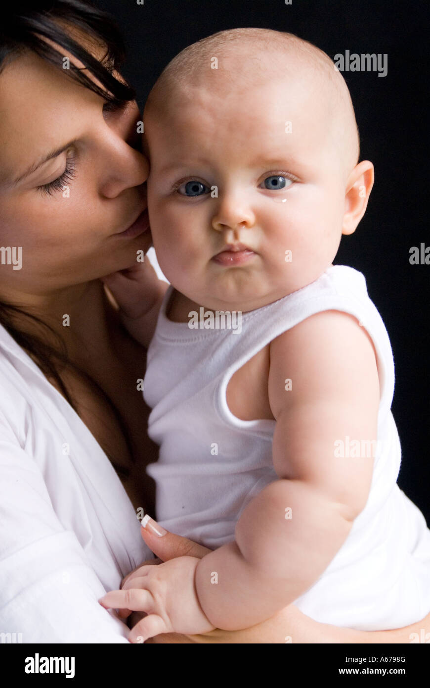 Mother comforts baby Stock Photo - Alamy