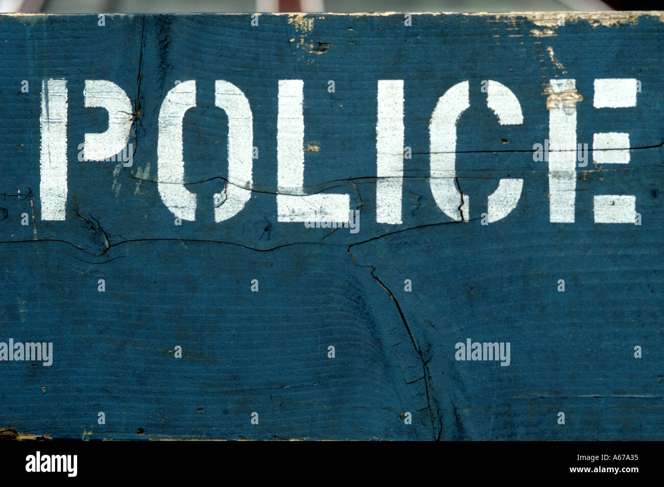 Police painted sign white on black Stock Photo - Alamy