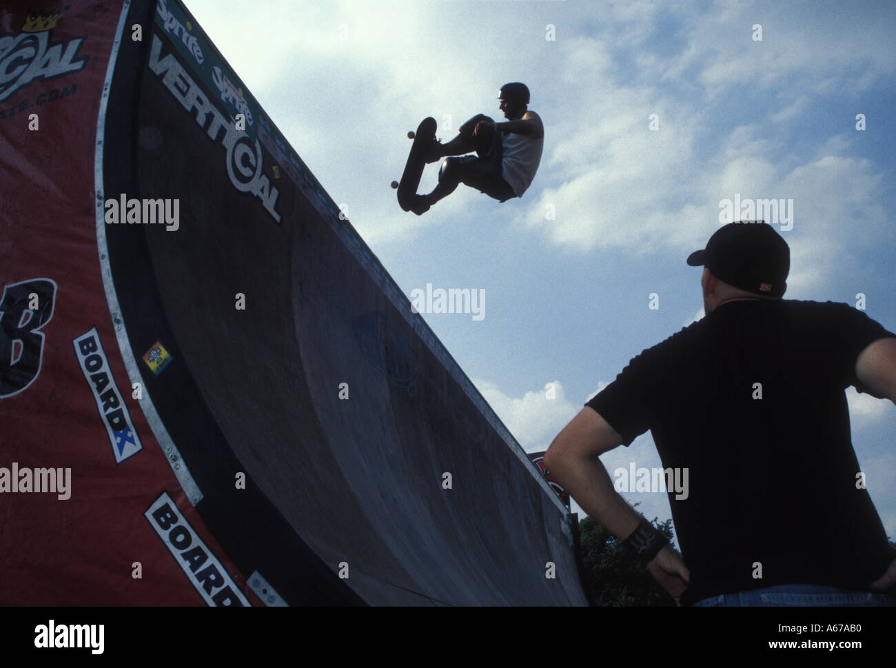 Skateboarder gets some air on the half pipe at the Stock Photo - Alamy