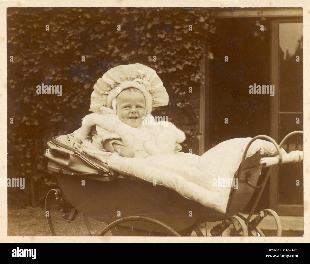 Baby In Pram Smiling Stock Photo - Alamy