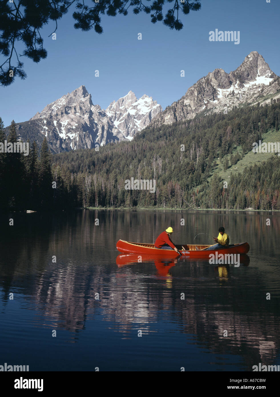 Two boys fishing on String Lake in Grand Teton National Park in Wyoming ...