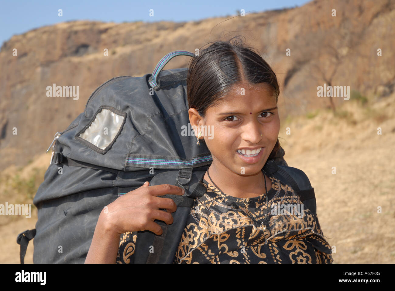 Manki carrying paraglider, Western Ghats, Kamshet, Maharashtra, India ...