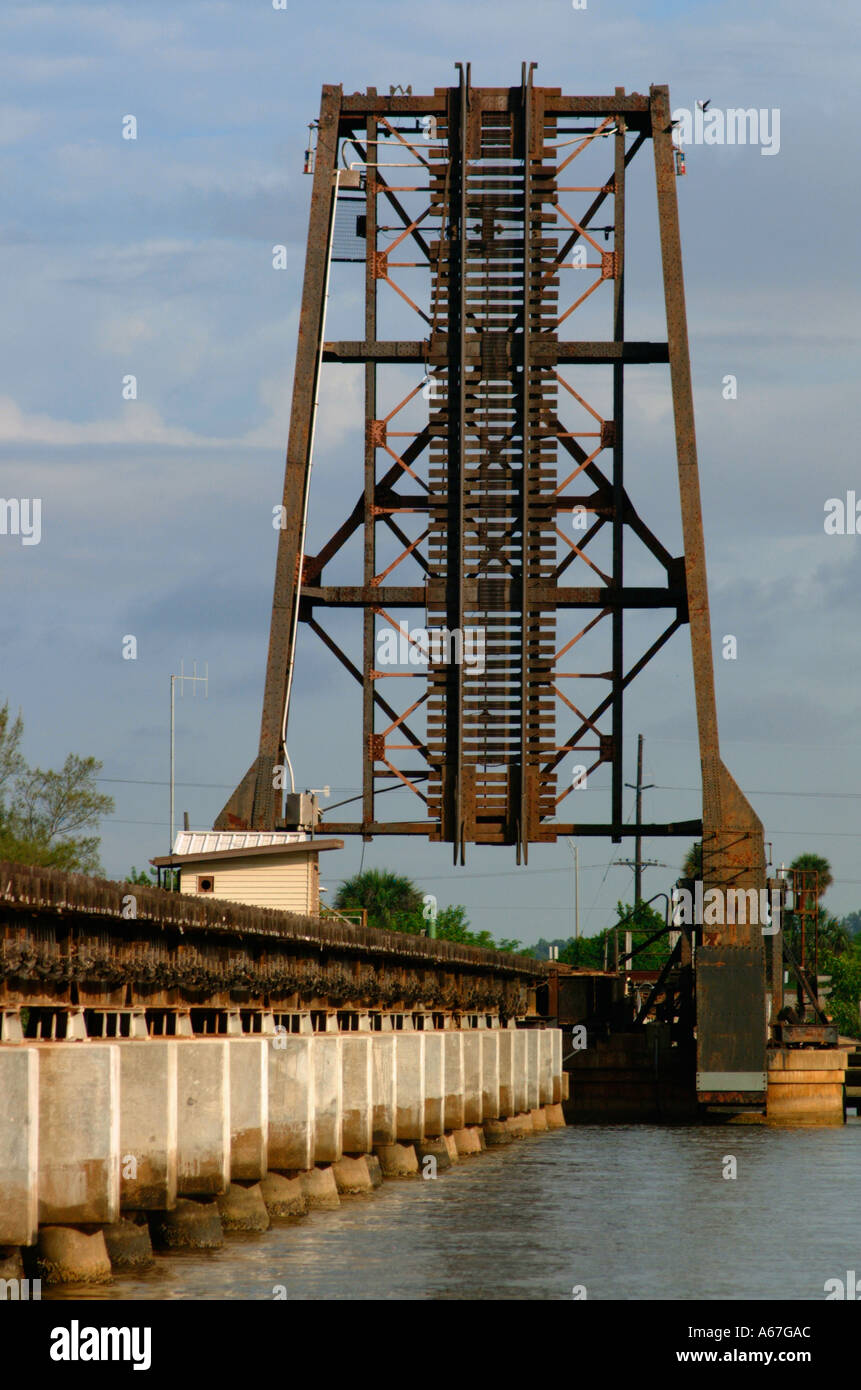 Raised railroad train bridge over water Saint Lucie River Martin County ...