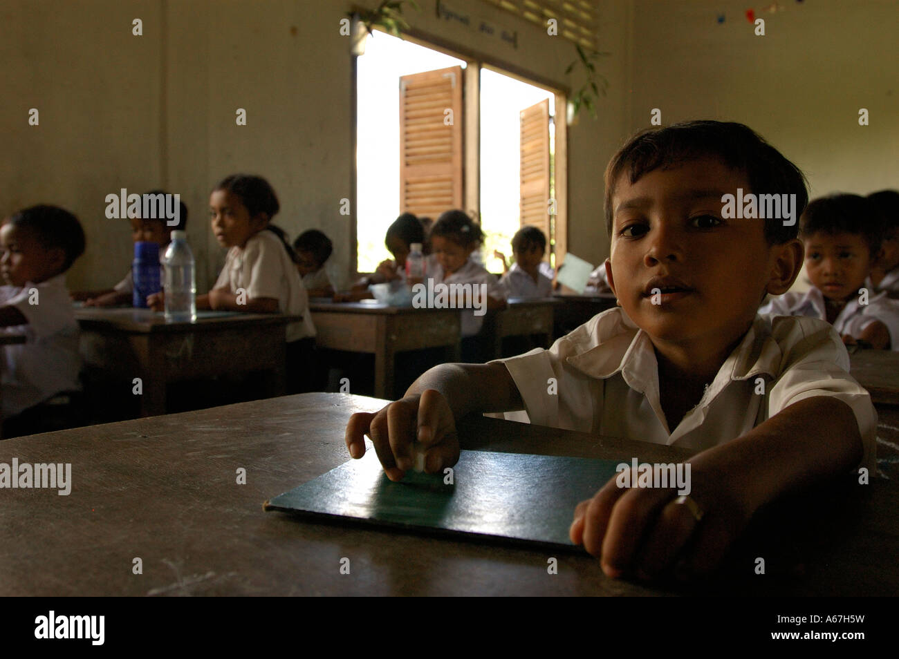 Khmer school children are studying in their classroom at the small Sras ...