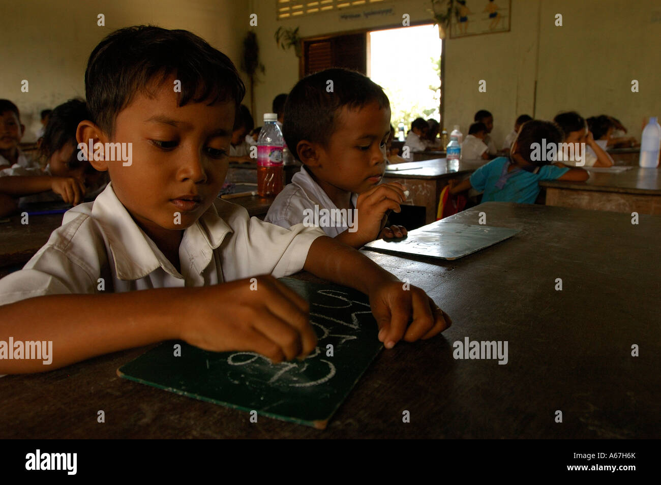 Khmer school children are studying in their classroom at the small Sras ...