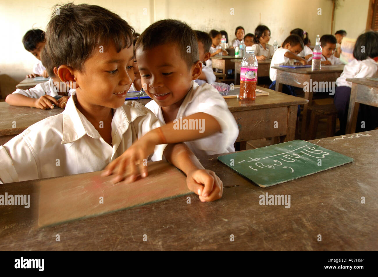 Khmer school children are studying in their classroom at the small Sras ...