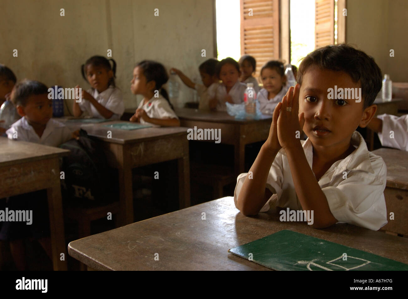 Khmer school children are studying in their classroom at the small Sras ...