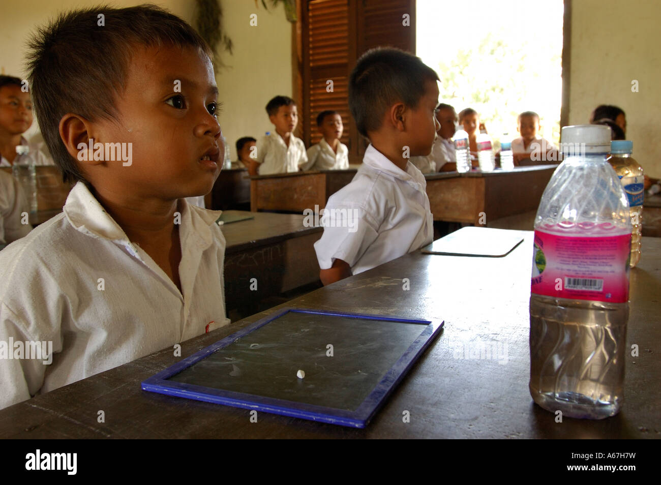 Khmer school children are studying in their classroom at the small Sras ...