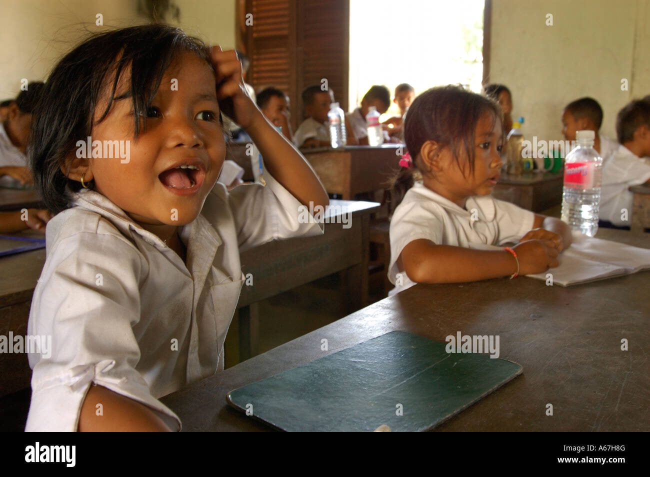 Khmer school children are studying in their classroom at the small Sras ...