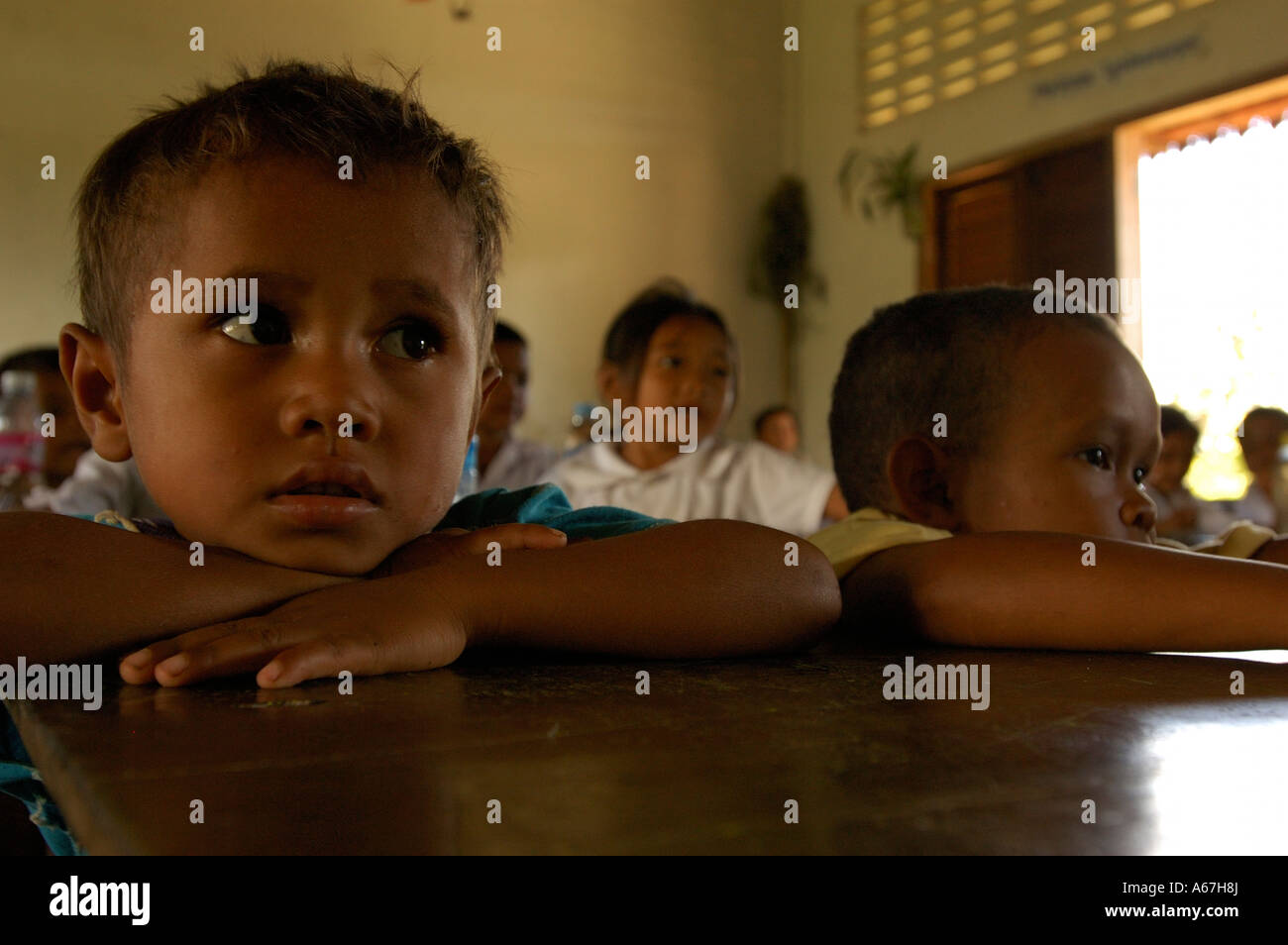 Khmer school children are studying in their classroom at the small Sras ...