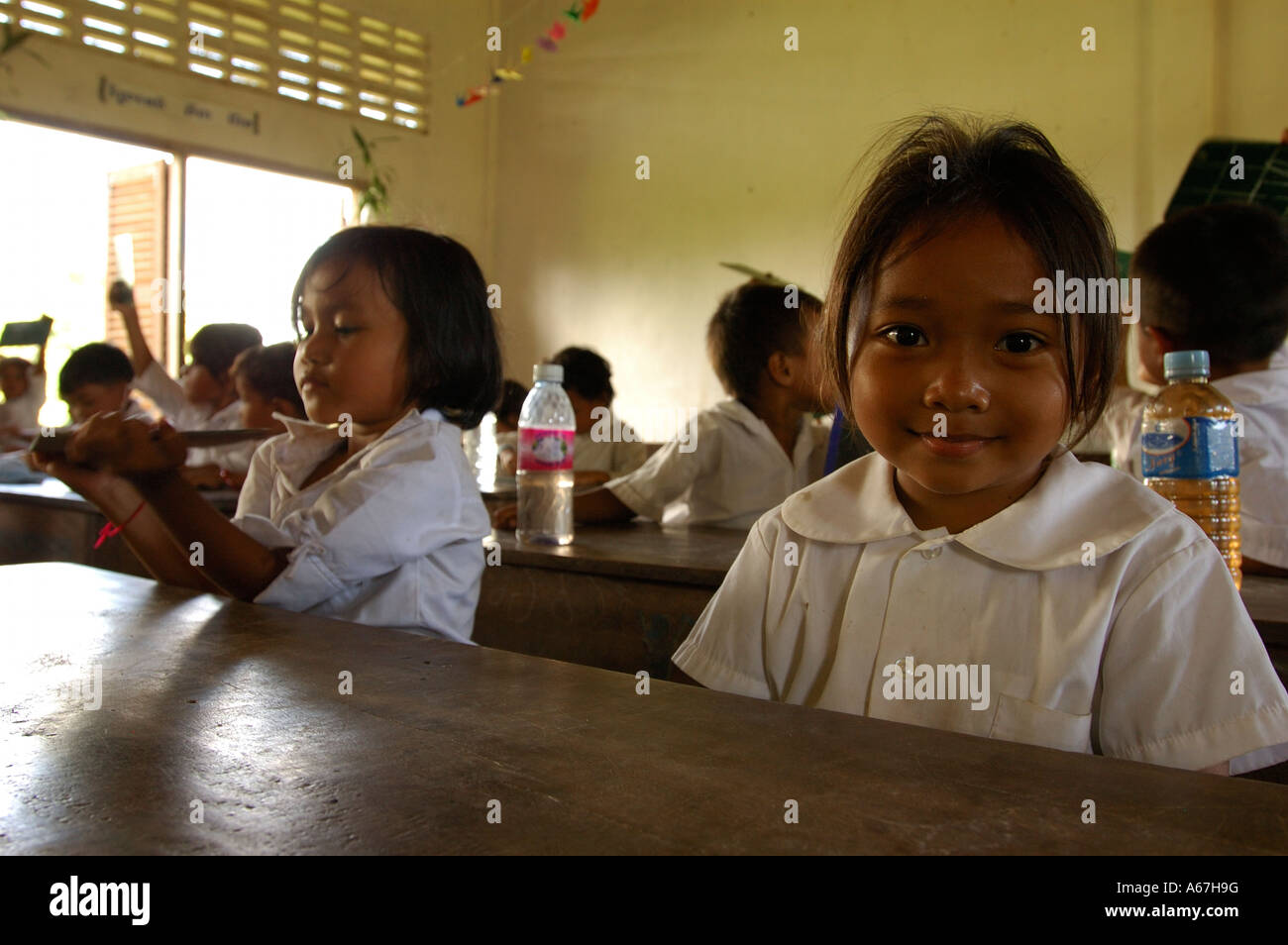 Khmer school children are studying in their classroom at the small Sras ...