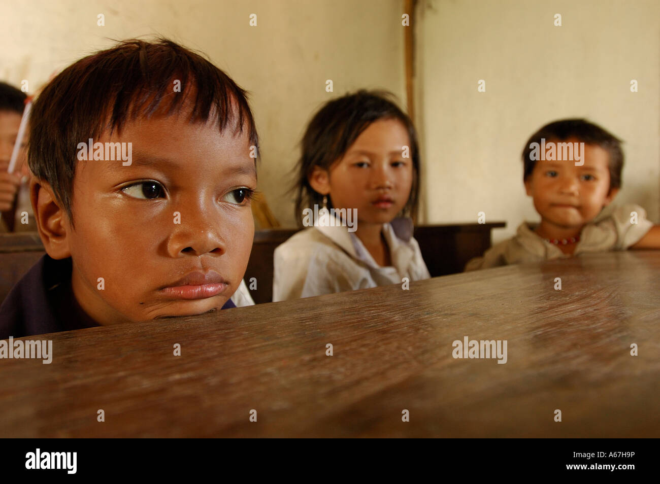 Khmer school children are studying in their classroom at the small Sras ...