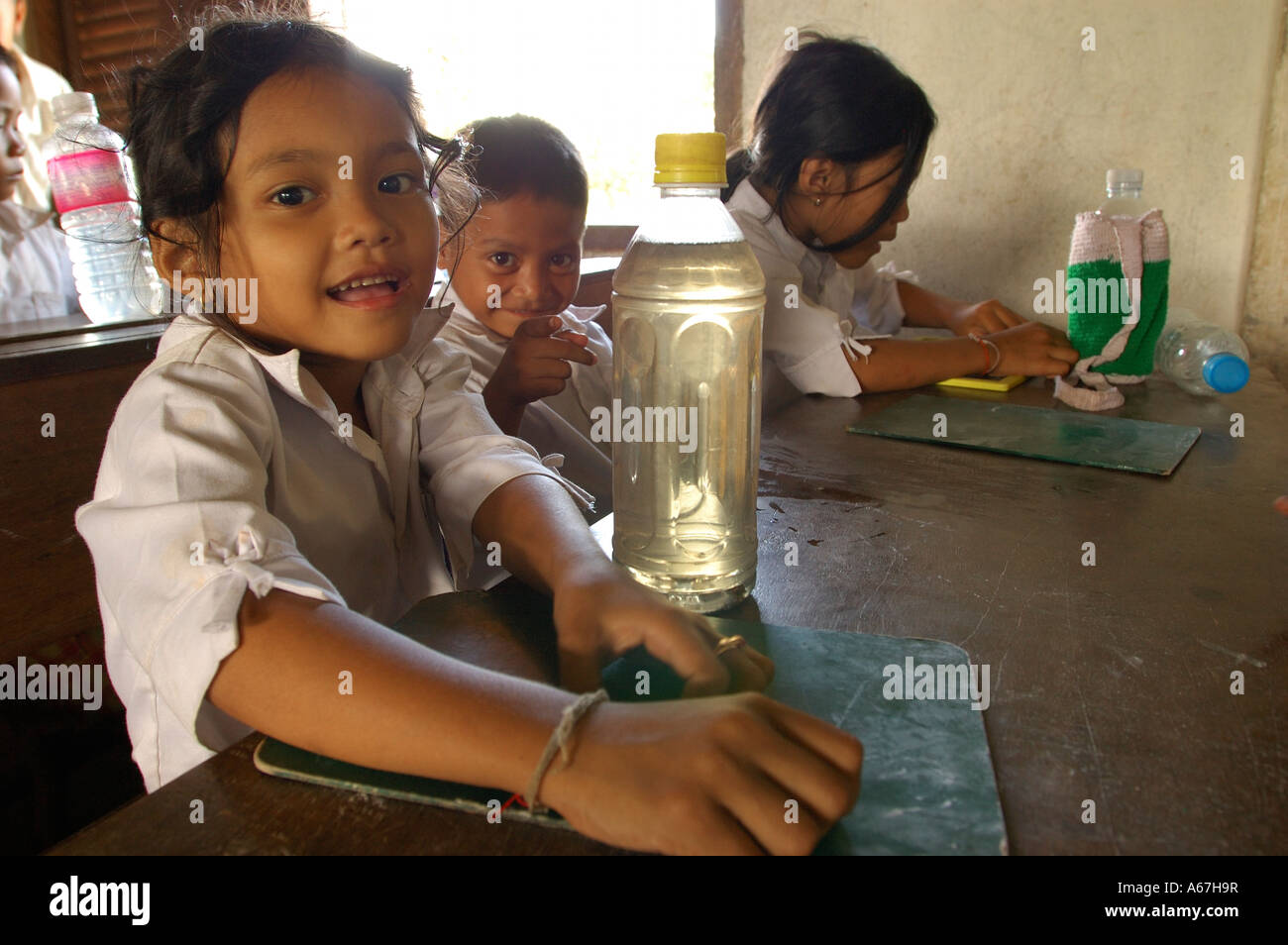 Khmer school children are studying in their classroom at the small Sras ...