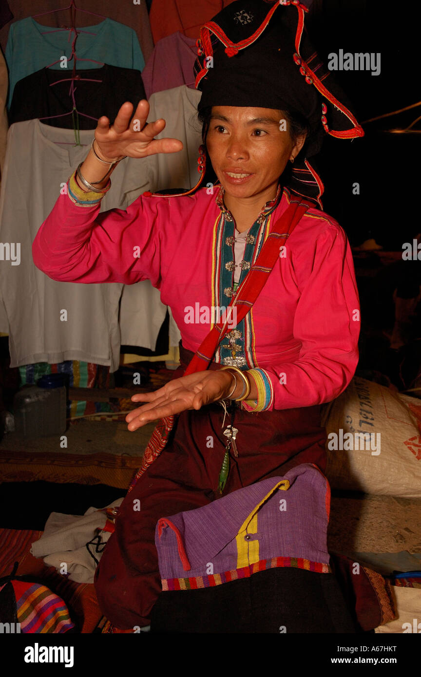 A Thai Dam indigenous woman sells her woven fabrics at the Luang ...