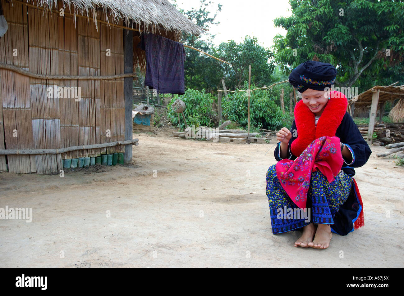 A young Yao (Mien) woman dressed in her tradtional tribal cloth, cloth ...